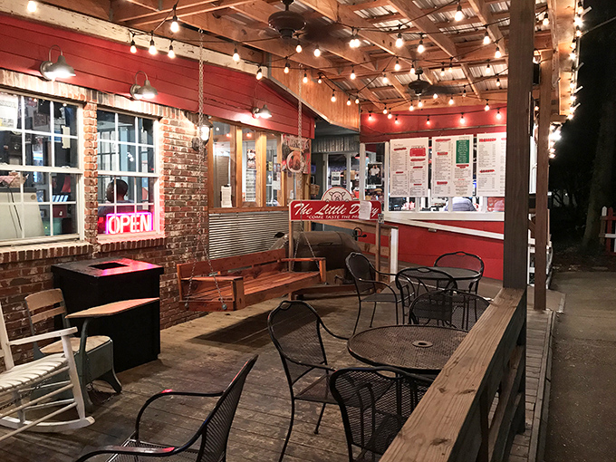 String lights illuminate the patio where evening BBQ sessions turn into memory-making moments under Mississippi stars.