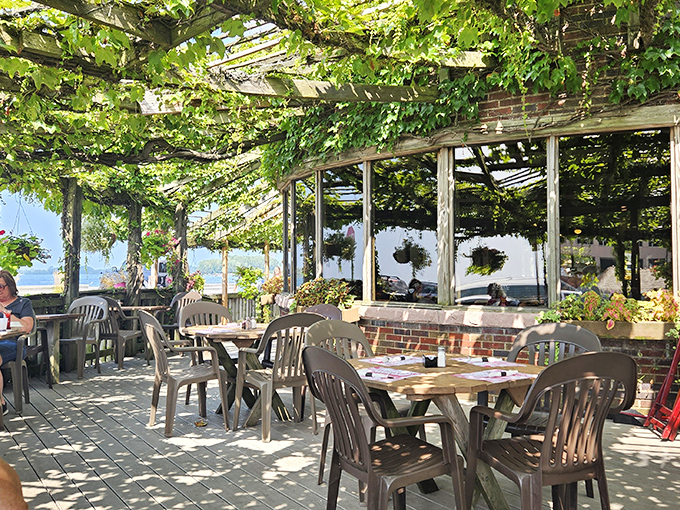 Dappled sunlight filtering through grape vines creates a Mediterranean atmosphere on this outdoor patio&mdash;Erie's answer to coastal dining.
