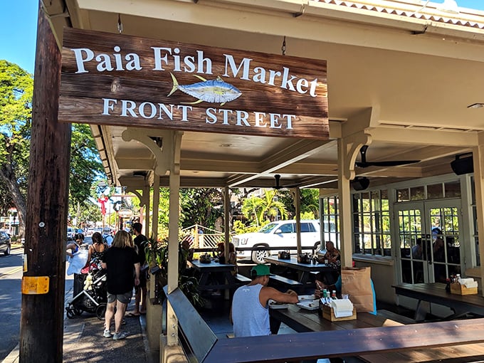 The patio sign welcomes you like an old friend, promising good times and great food under the gentle Maui sunshine.