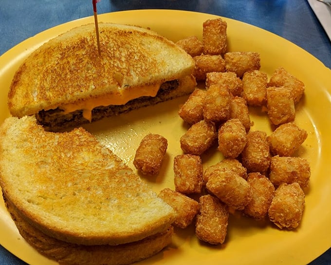 The humble patty melt, perfected. Crispy bread, melted cheese, and a burger that knows its purpose in life. Tater tots standing by for backup.