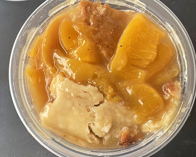 Peach cobbler that captures Georgia sunshine in every spoonful. The perfect marriage of flaky crust and tender fruit that makes you close your eyes in silent appreciation.