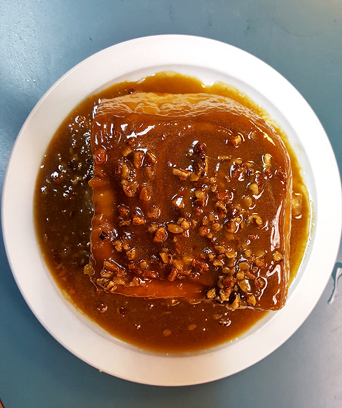 Caramel pecan roll swimming in buttery sauce &ndash; not just a breakfast item but a commitment to starting your day with unabashed joy.