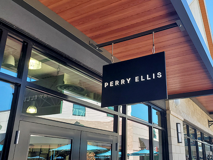 Perry Ellis brings its sophisticated menswear to the outlets, where husbands can finally understand their wives' excitement about finding designer deals.