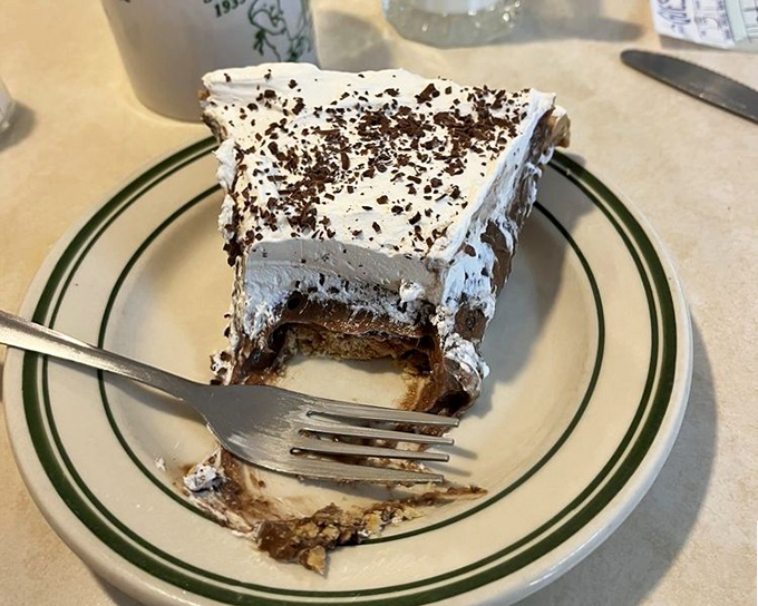 Chocolate cream pie with evidence of the crime. The fork tells the story of a dessert that never stood a chance.
