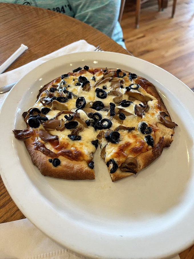 This isn't artisanal wood-fired pizza with imported buffalo milk mozzarella—it's honest, delicious comfort food that reminds you why simple pleasures endure.