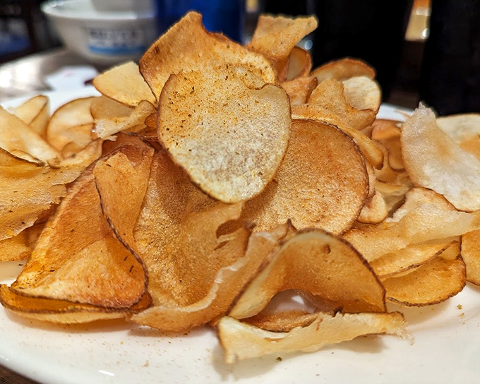 Homemade potato chips that shatter with each bite. These aren't your bag-from-the-store chips—they're crispy discs of potato perfection.