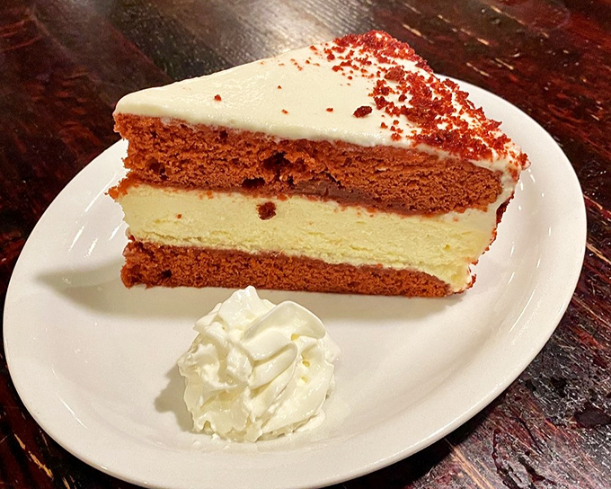 Red velvet cheesecake that combines two dessert legends into one slice of heaven&mdash;proof that teamwork really does make the dream work.