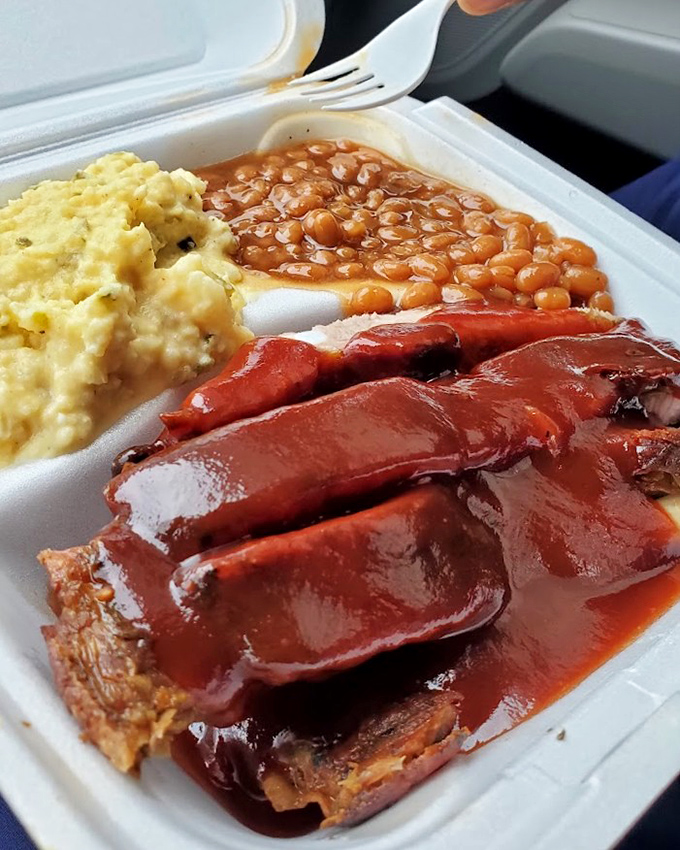 Saucy ribs with potato salad and beans&mdash;the holy trinity of barbecue that justifies every mile of your journey to Homewood.