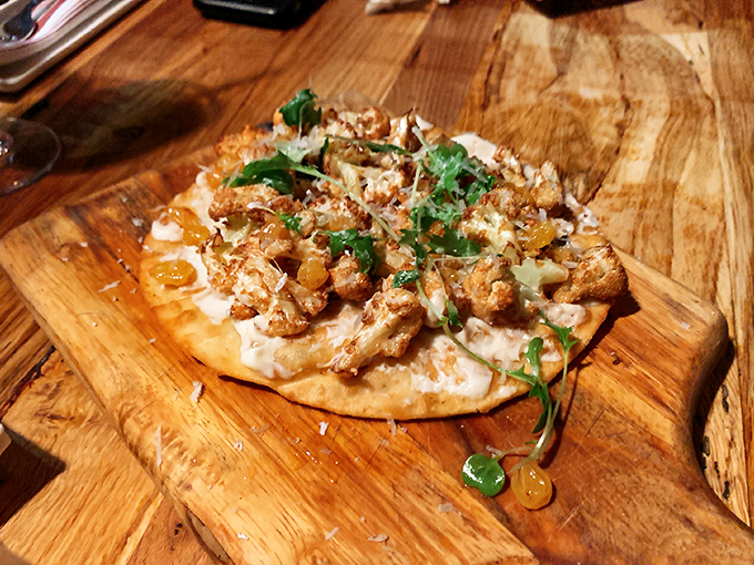 Cauliflower flatbread that's converted more vegetable skeptics than any dish in Philadelphia. The crispy edges tell the whole story.