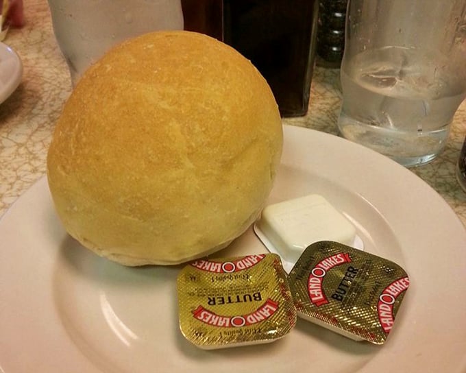 The dinner roll with butter packets &ndash; humble beginnings to a meal that proves simplicity is the ultimate sophistication.