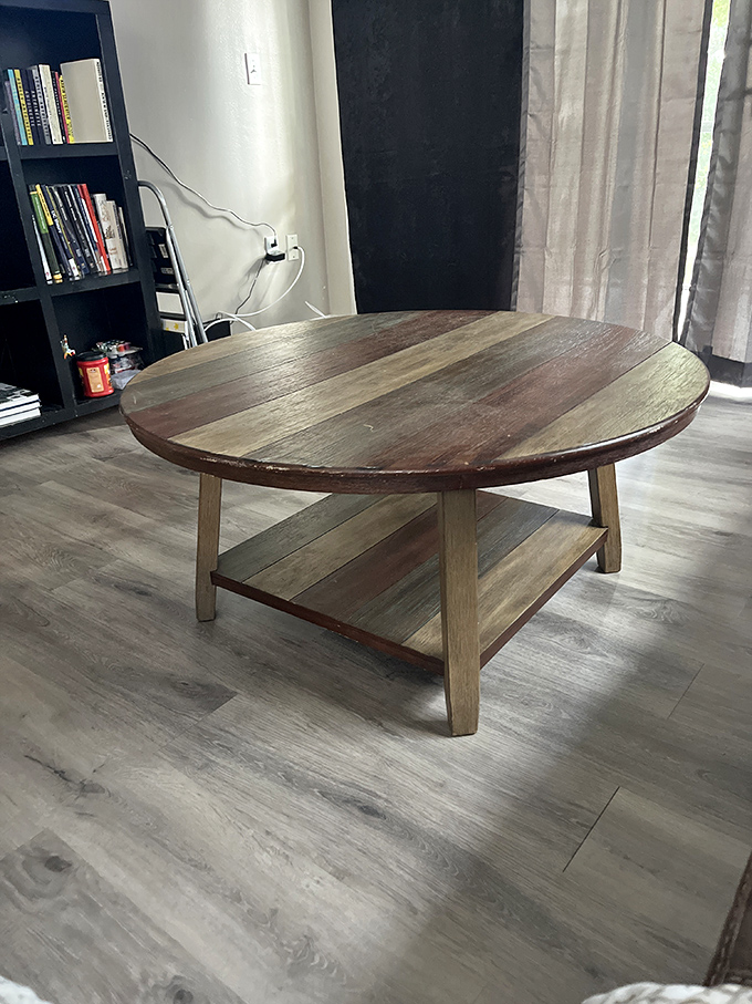 This round wooden coffee table has the rustic charm of a piece that costs ten times more at those fancy furniture boutiques.