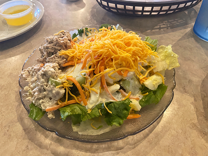 A salad that knows its role in the buffet ecosystem. Fresh, crisp, and colorful—it's the virtuous prelude to your seafood symphony.