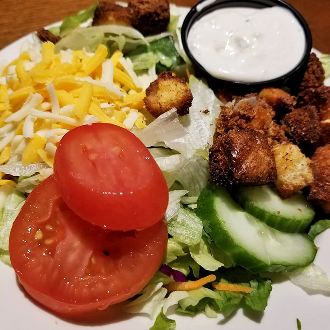 Even the salads get special treatment here &ndash; fresh vegetables, shredded cheese, and house-made croutons prove that sides aren't an afterthought at this barbecue haven.