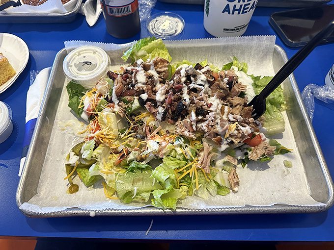 Even the salads get the barbecue treatment&mdash;proof that vegetables can find happiness when topped with smoked meat and surrounded by sauce.