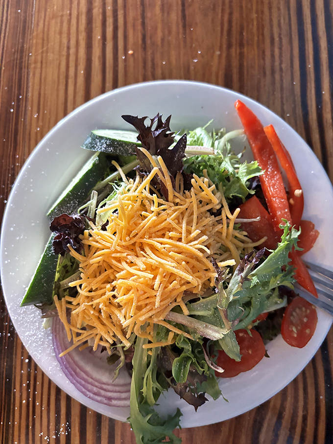 A simple side salad that knows its role&mdash;bringing just enough freshness and color to balance out that massive steak you ordered.