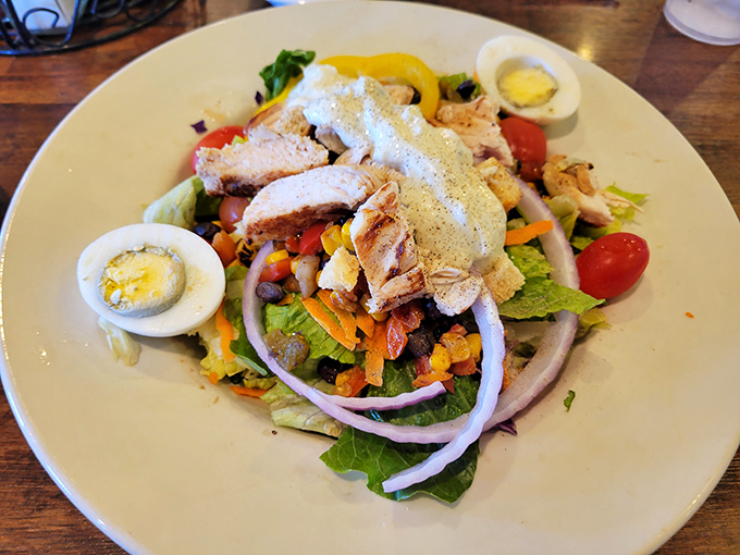 A salad that apologizes for being healthy by bringing along protein, eggs, and enough toppings to satisfy even the carnivores.
