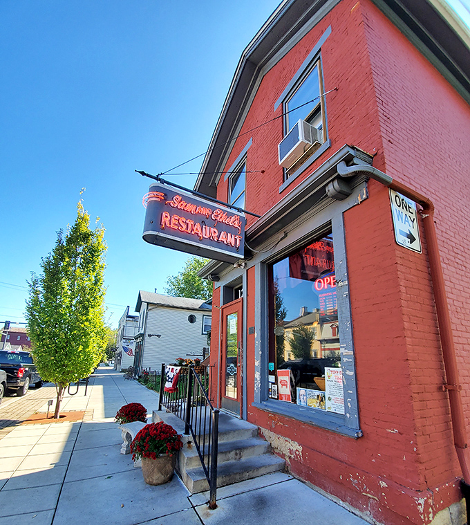 Sam and Ethel's Restaurant glows with small-town hospitality, its vintage neon sign promising comfort food that makes you feel like family, not just a customer.