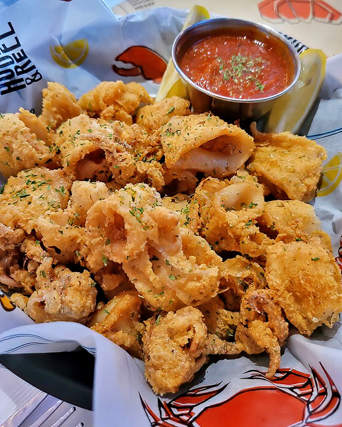 Crispy calamari that practically begs to be dunked in that vibrant marinara. Fried seafood nirvana that's worth every crunchy bite. 