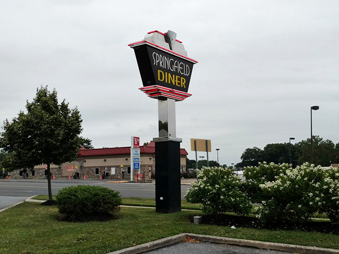 The iconic Springfield Diner sign stands tall against the Pennsylvania sky, a landmark that's guided hungry travelers to comfort food heaven for generations.