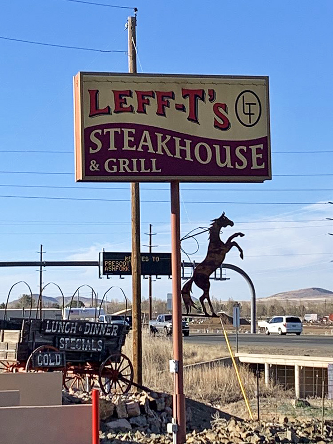 The roadside sign stands tall against the Arizona sky, a beacon for hungry travelers. That rearing horse silhouette promises authentic western hospitality awaits.
