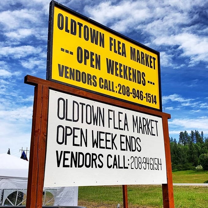 The market's cheerful yellow sign stands as a weekend beacon, promising adventures in bargain hunting against Idaho's evergreen backdrop.