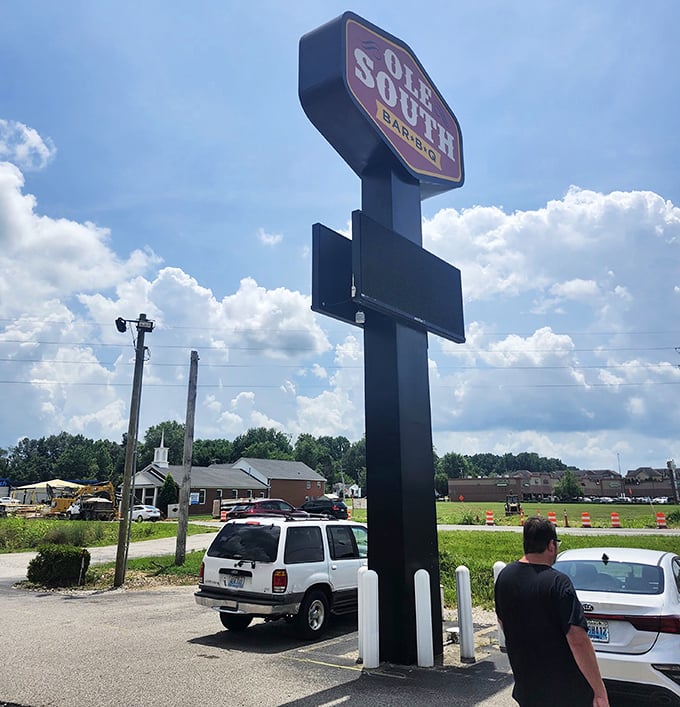 The sign stands tall against the Kentucky sky, a beacon of barbecue hope for hungry travelers and locals alike.