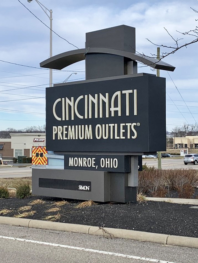 The prominent signage welcomes visitors to Monroe's retail destination where designer dreams meet reality.
