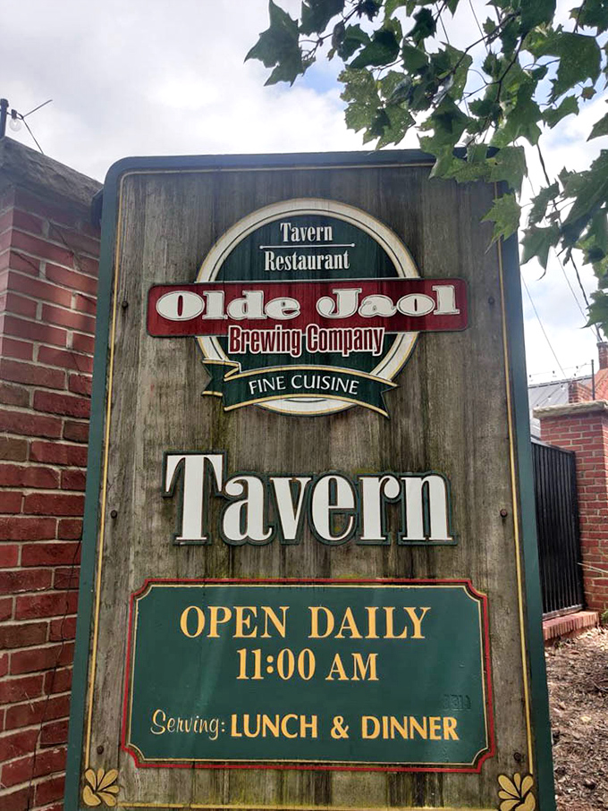 The sign that promises tavern comfort with brewing company credentials – a combination that rarely disappoints hungry travelers.
