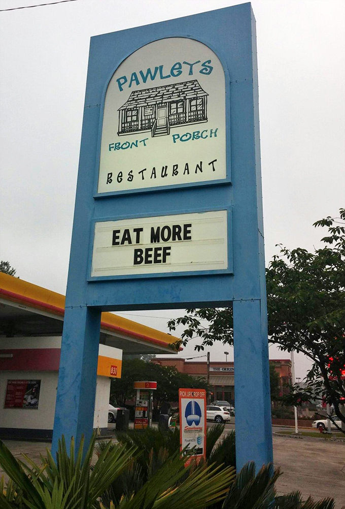 The sign says "EAT MORE BEEF"&mdash;three words that function as both command and promise of happiness to come.