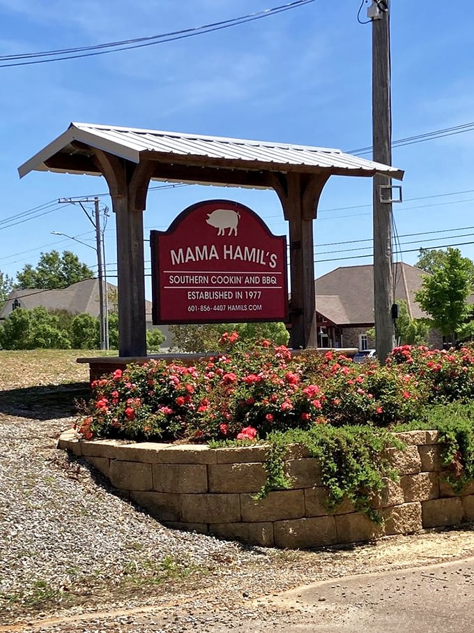 The sign surrounded by flowers welcomes you like an old friend, promising comfort food and the kind of meal you'll remember.