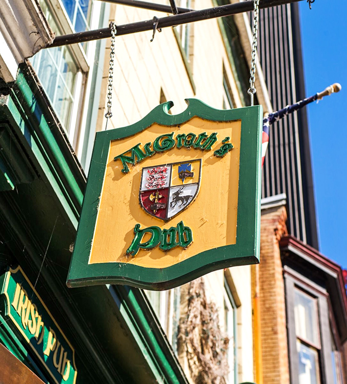 The hanging shield sign marks the spot like X on a treasure map – McGrath's coat of arms promising liquid gold and culinary treasures within.