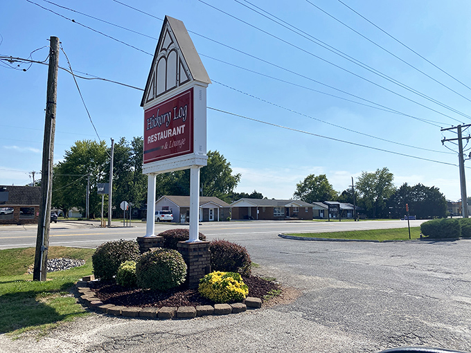 The sign stands as a beacon of hope for hungry travelers &ndash; "Hickory Log Restaurant" might as well read "Salvation for Empty Stomachs Ahead."