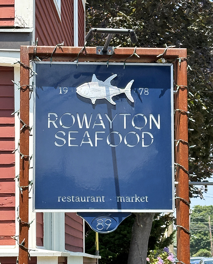 The sign says "Rowayton Seafood" but might as well read "Happiness Served Daily." Those twinkling lights aren't just decoration&mdash;they're celebration.