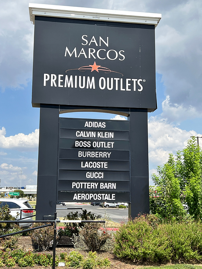 The iconic sign stands tall like a beacon of bargains, listing brands that normally require a lottery win.