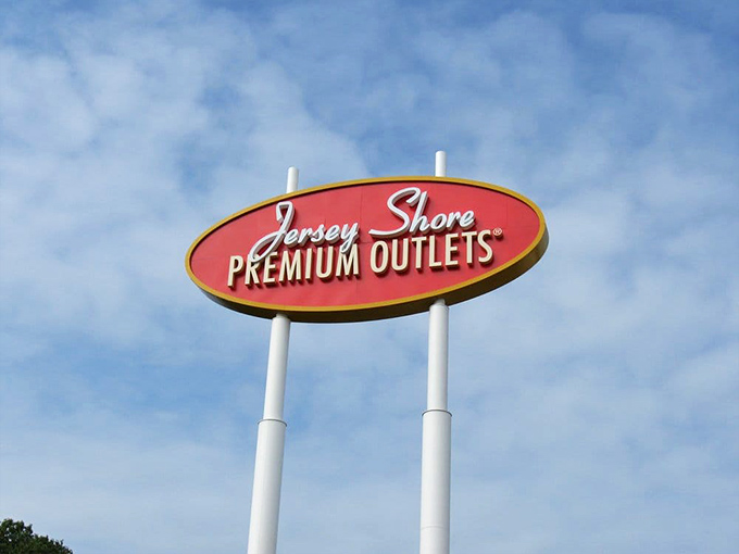 The iconic Jersey Shore Premium Outlets sign against blue skies &ndash; a symbol of hope for fashion lovers and a warning to credit card companies everywhere.