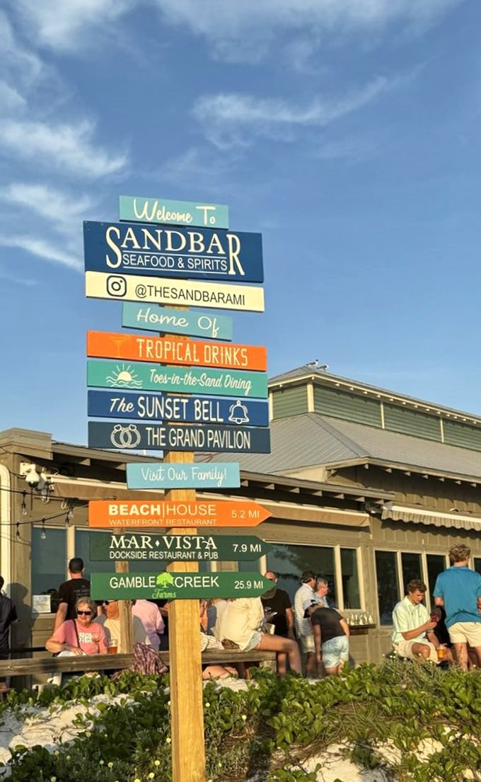 The sign says it all: tropical drinks, toes-in-the-sand dining, and sunset celebrations. This isn't just a restaurant&mdash;it's Florida's greatest hits album.