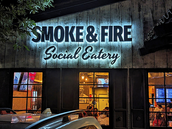 When the sun goes down, the sign lights up, beckoning hungry souls toward smoky salvation like a barbecue lighthouse.