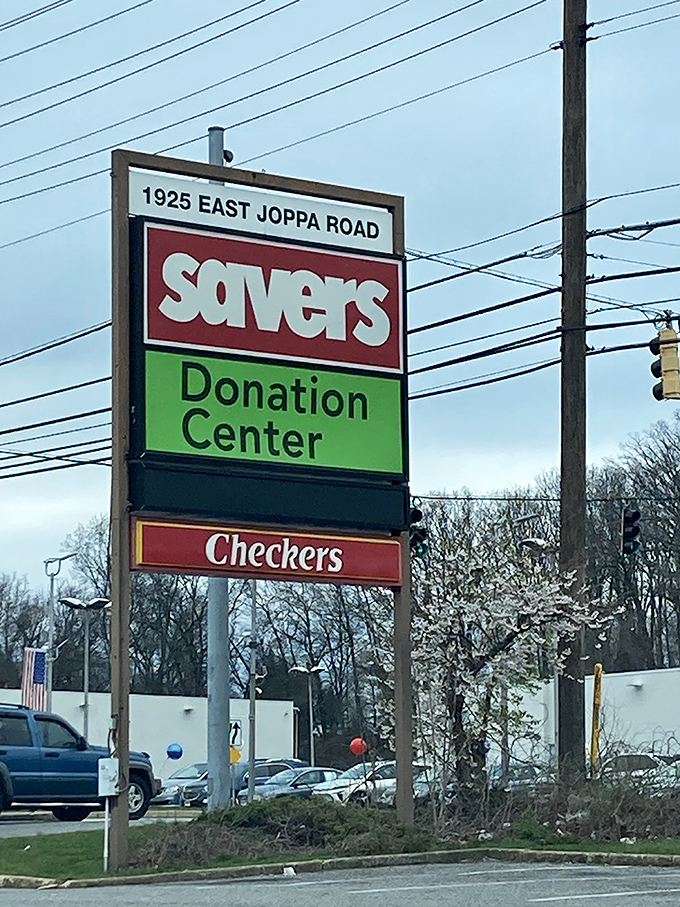 The roadside beacon at 1925 East Joppa Road announces not just a store, but a donation center. The circle of thrifting life continues.