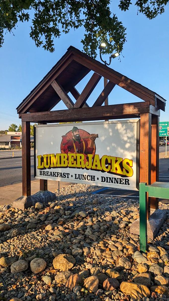 The sign stands like a beacon of breakfast hope along the highway, promising three square meals in a world of round disappointments.