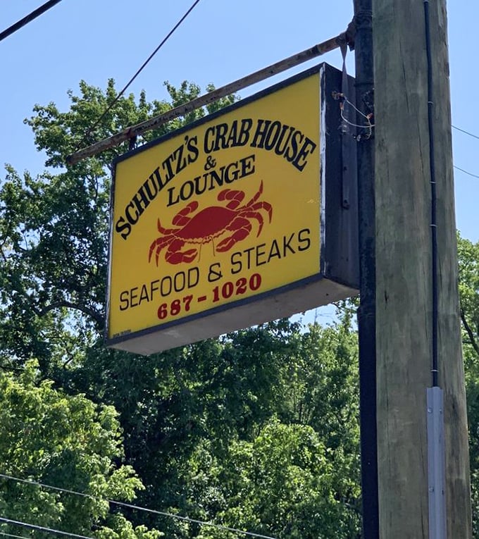 The sign promises seafood and steaks, but locals know it's really advertising a direct portal to Maryland culinary heaven, no reservations required.