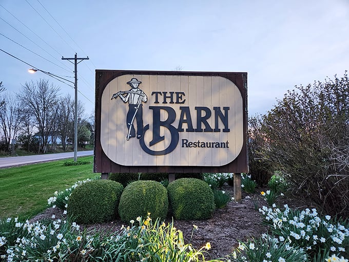 The classic sign welcomes travelers to slow down, park the car, and prepare for an authentic farm-to-table experience.