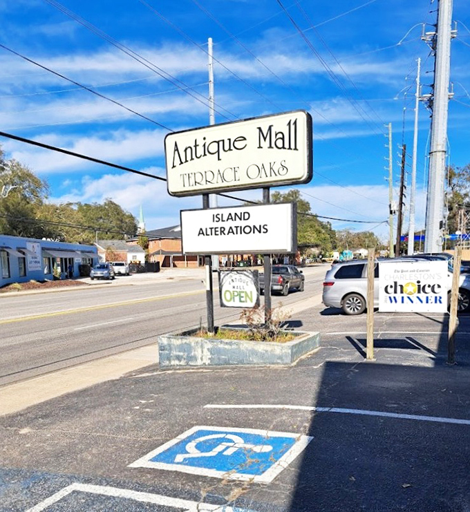 The roadside sign stands as a beacon to treasure hunters, promising adventures in antiquing that GPS directions simply can't prepare you for.
