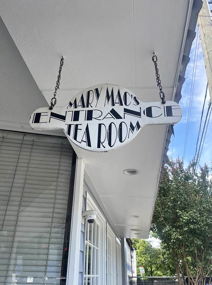 The hanging entrance sign doesn't just mark a doorway &ndash; it's a portal to a world where Southern hospitality isn't just practiced, it's perfected.