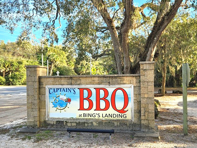 The sign that launches a thousand appetites. Like a barbecue lighthouse guiding hungry souls to smoky salvation at Bing's Landing.