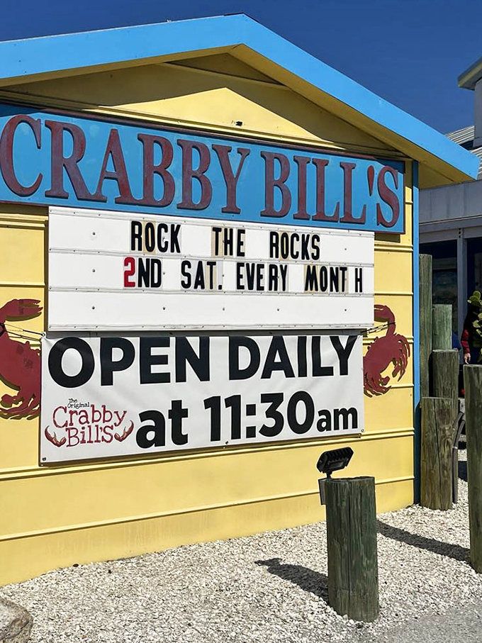 The cheerful yellow sign announces daily opening times, standing as a beacon of hope for the hungry since long before Instagram.