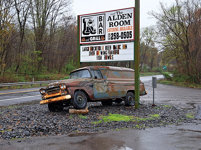 That vintage truck beneath the sign isn't decoration—it's a warning that once you visit, your taste buds may never leave.