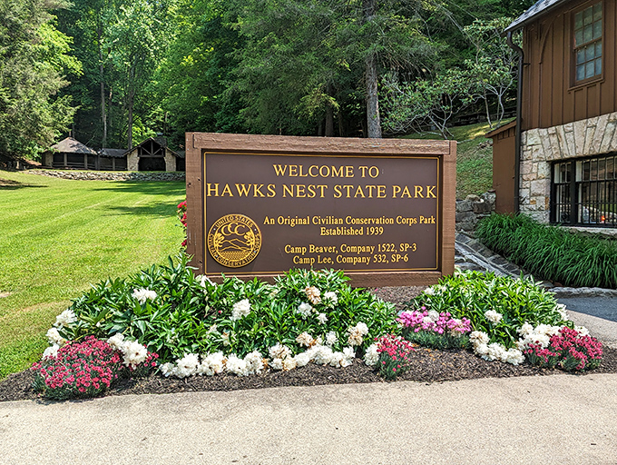 First impressions matter: The welcoming entrance sign, surrounded by seasonal blooms, hints at the natural beauty waiting just beyond the park gates.