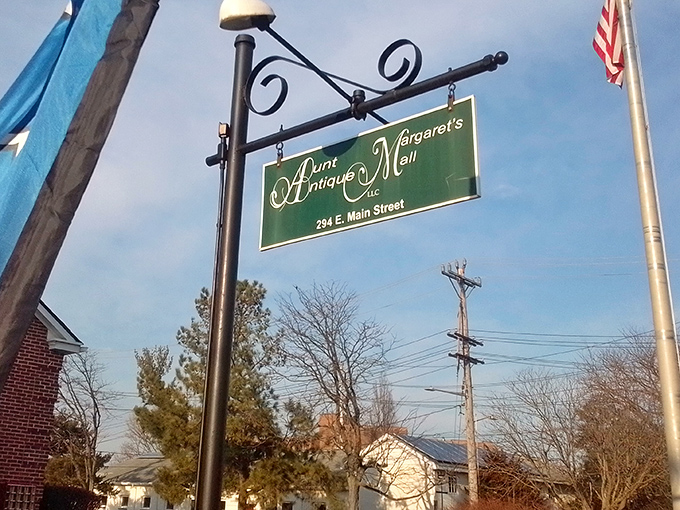 The hanging sign marks the spot where treasure hunters converge. Like a green beacon calling to all who appreciate history's cast-offs and overlooked gems.