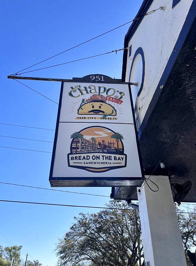 Sharing real estate with Los Chapos Tacos, this sign promises a journey to sandwich nirvana just beyond the Tampa sidewalk.