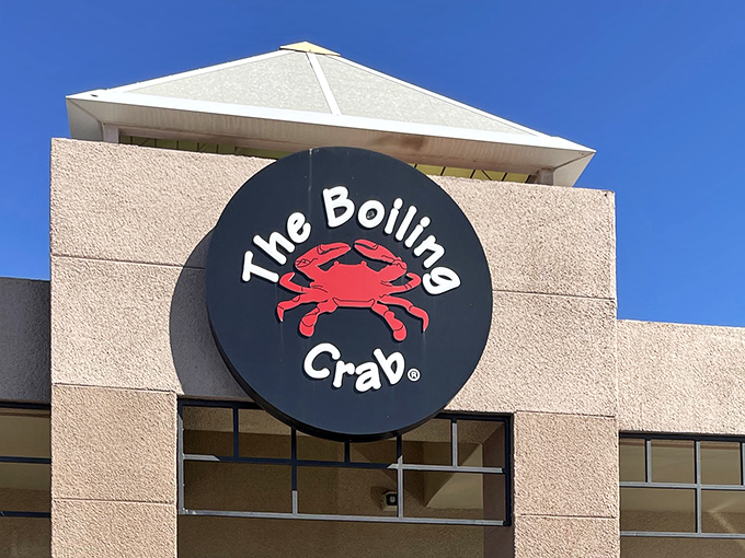 The iconic red crab logo announces your destination has arrived, promising messy eating and memorable flavors just beyond those doors.